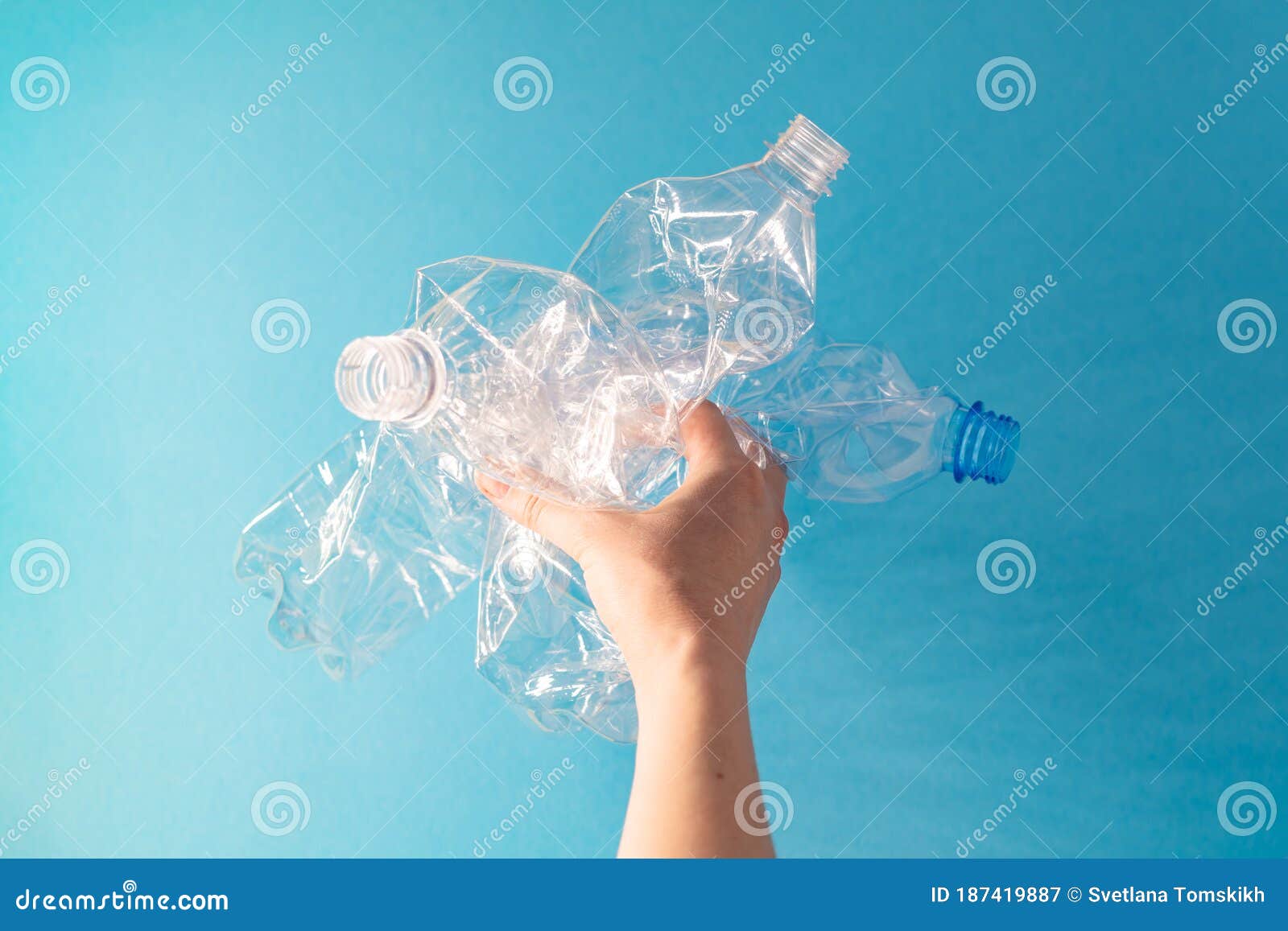 Recycling Concept. Female Hand Holds a Rumpled Plastic Bottles ...