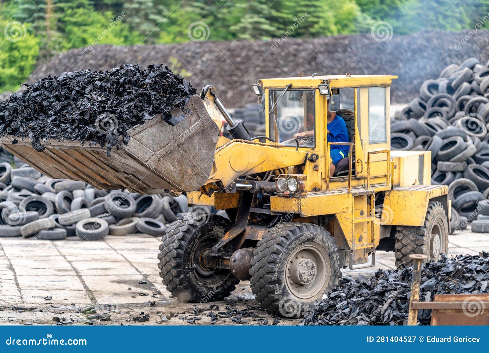 Recycling of Old Tires, Excavator Loading of Crushed Rubber into a ...