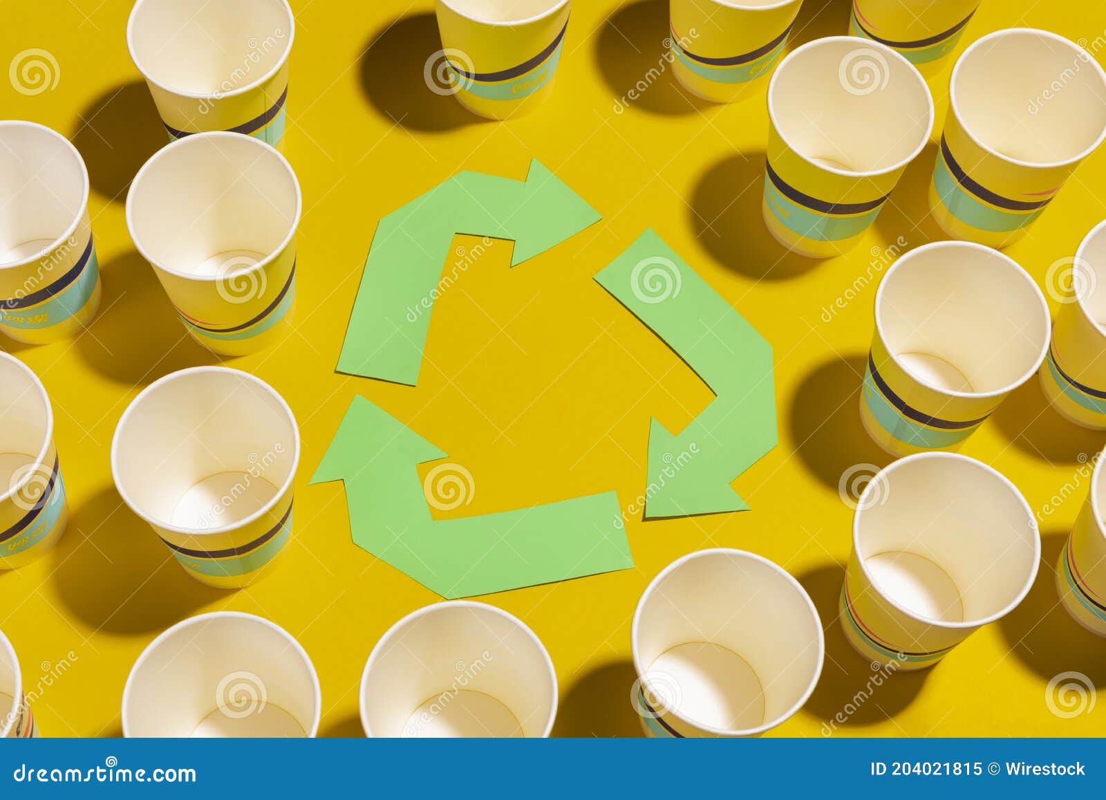 Recycling Sign and Paper Cups on Yellow Surface Stock Image - Image of ...