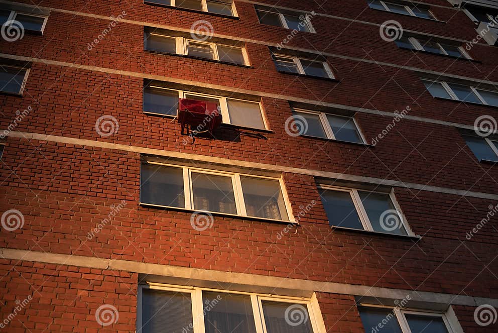 Red Air Conditioner on the Facade of a Brick Building Stock Image ...