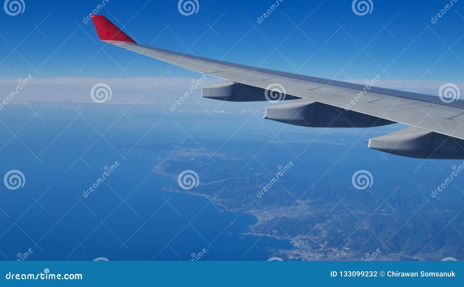 Red air plane on blue sky stock photo. Image of blue - 133099232