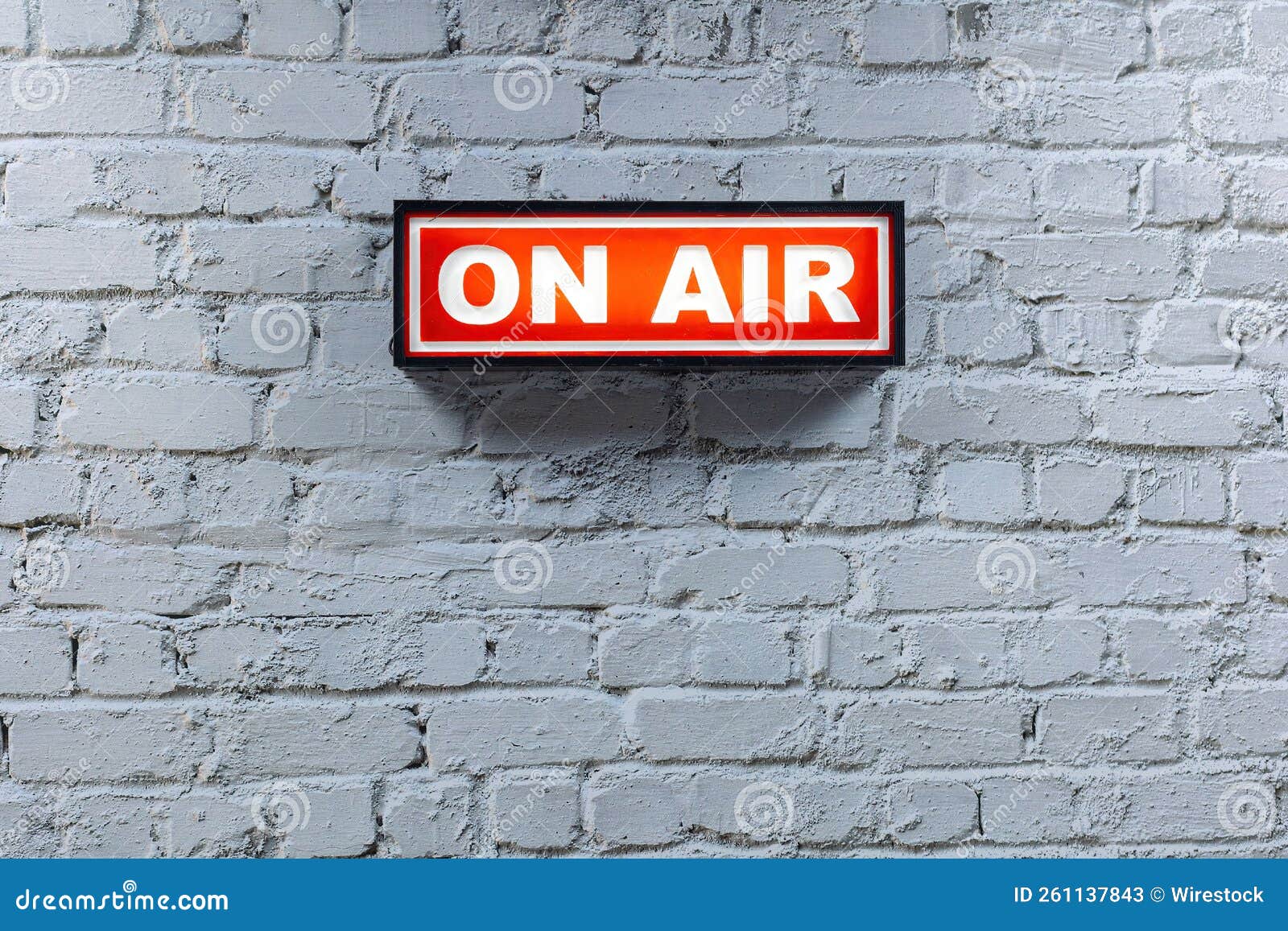 Red on Air Sign Against a White Brick Wall Stock Image - Image of logo ...