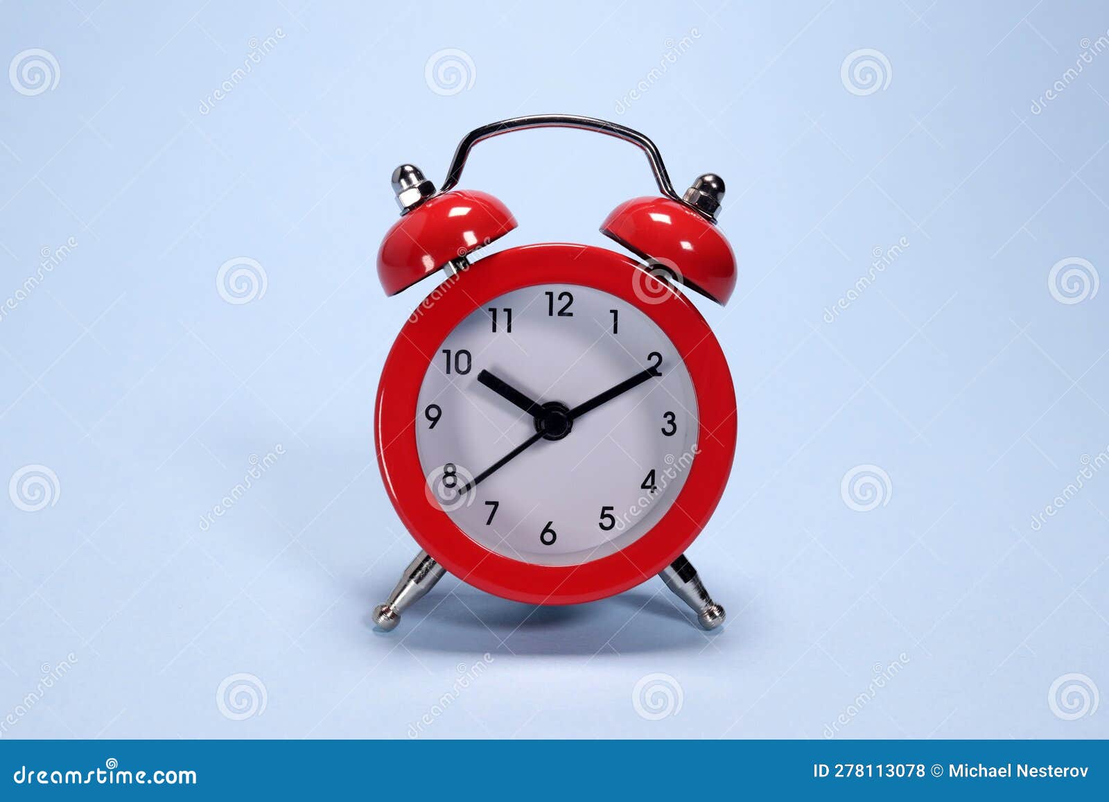 Red Alarm Clock on a Blue Background Stock Photo - Image of front ...
