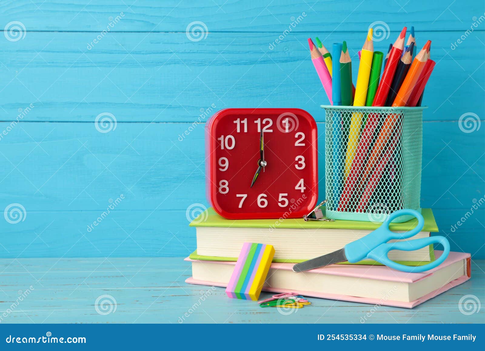 Red Alarm Clock and School Accessories on a Blue Background. Back To ...