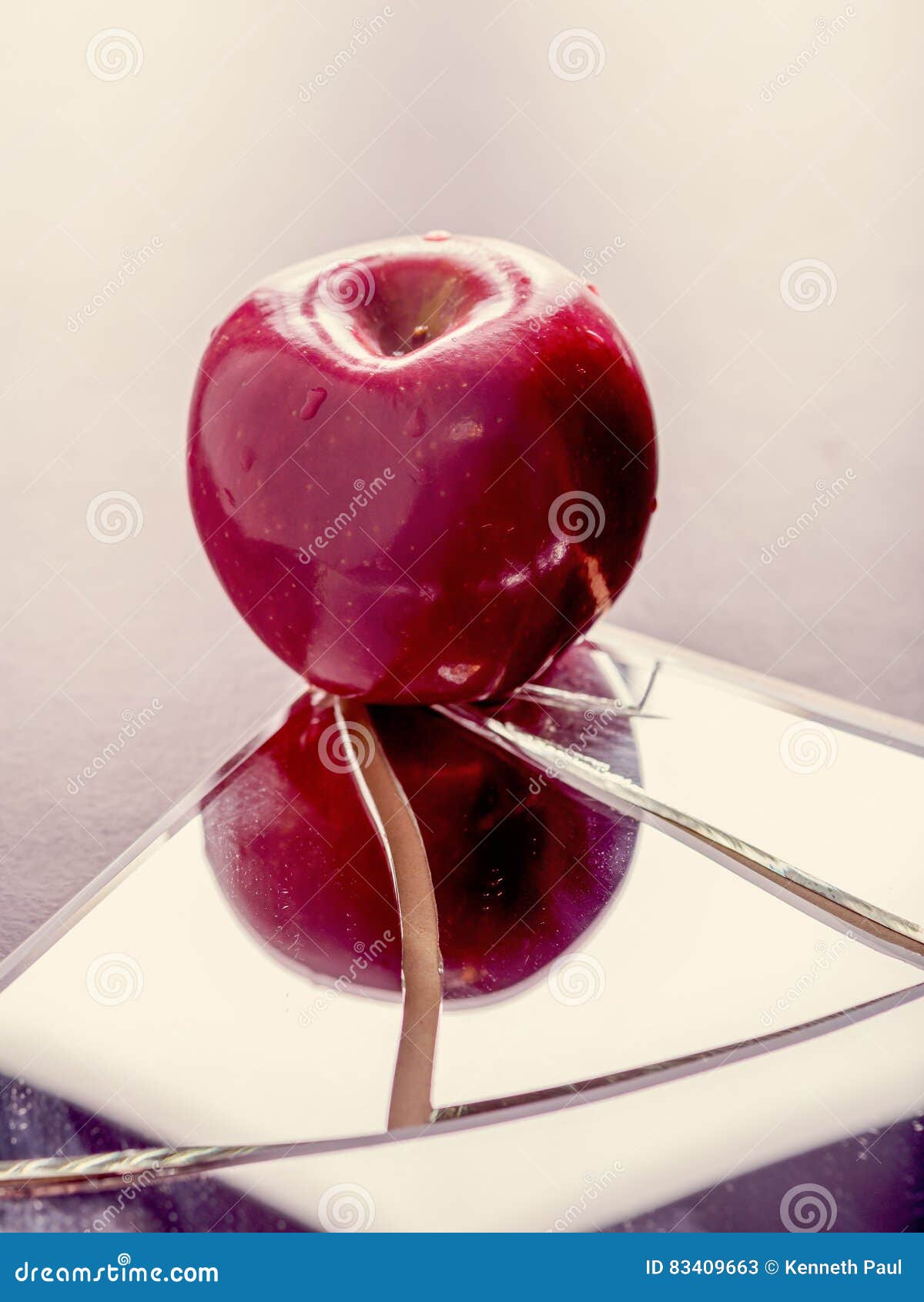 Red apple on broken mirror stock image. Image of glass - 83409663