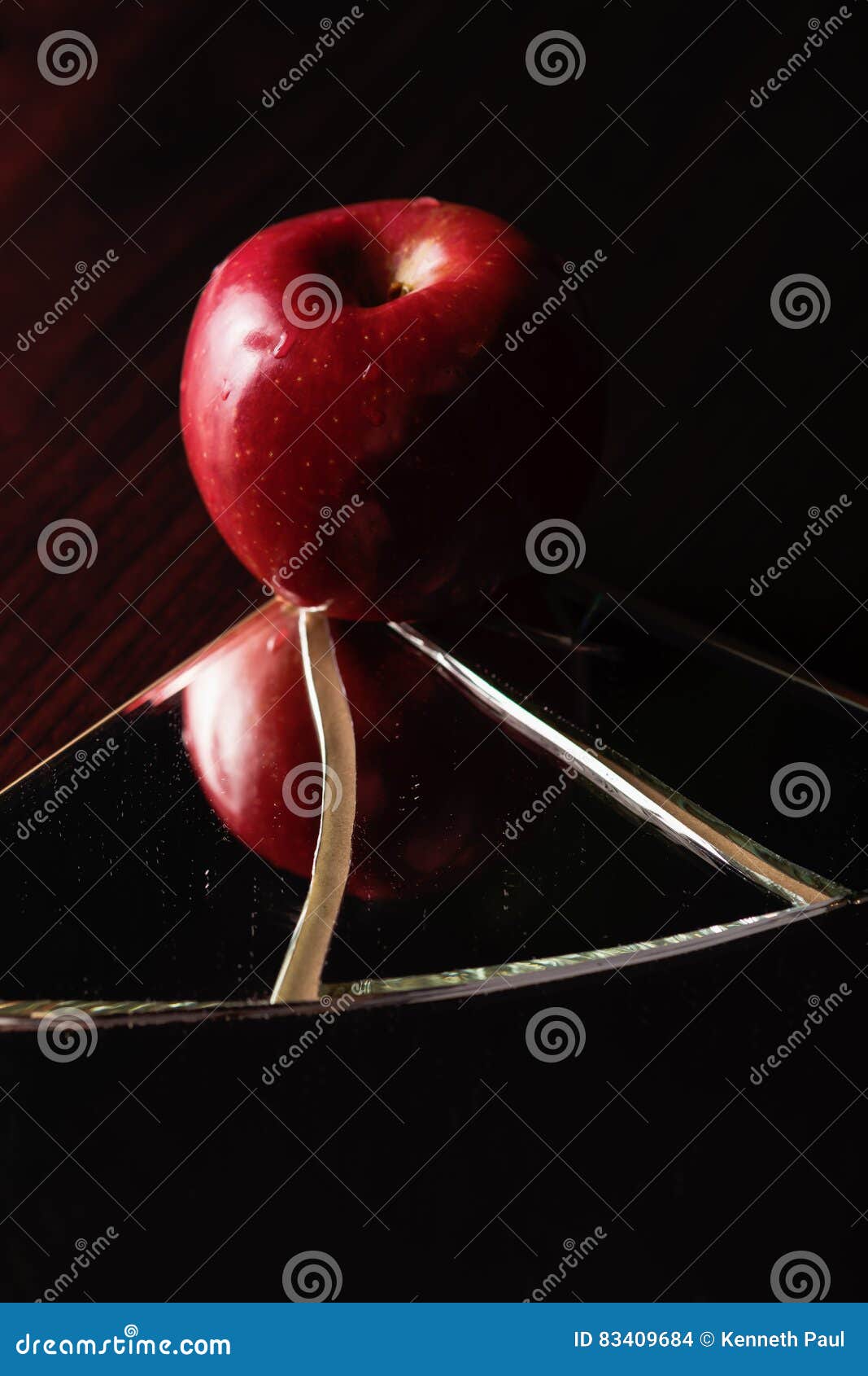 Red apple on broken mirror stock photo. Image of fresh - 83409684