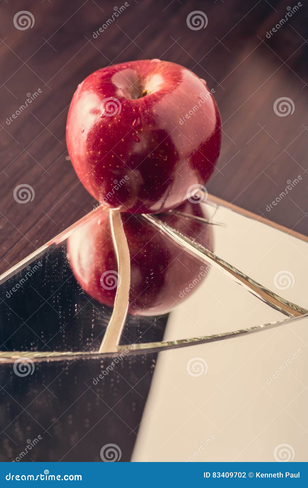 Red apple on broken mirror stock photo. Image of shattered - 83409702