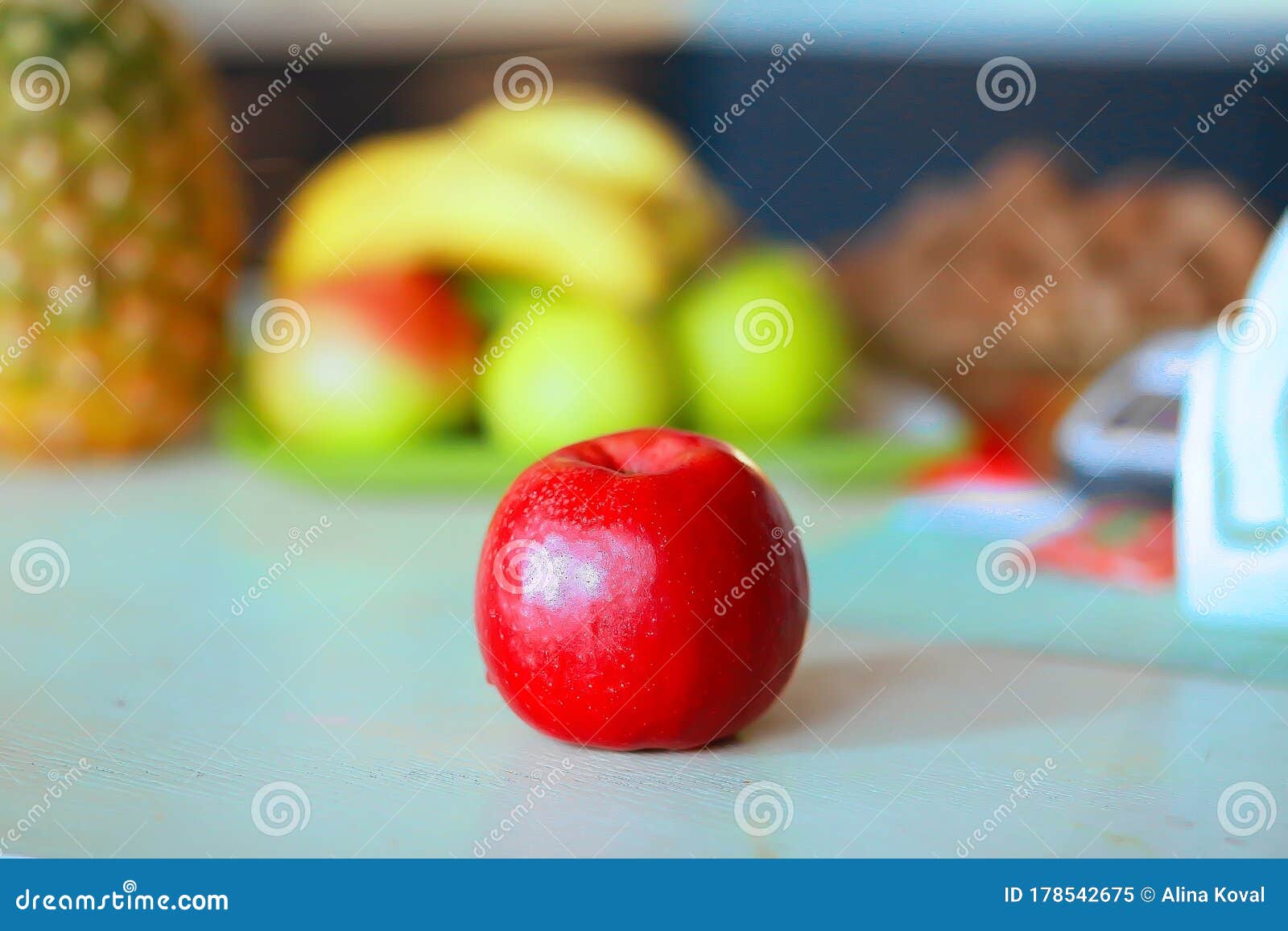 Red Apple, Diverse Fruits on a Table in a Modern Kitchen. Useful ...