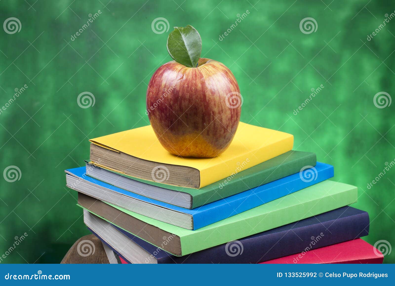 Apple Fruit on Top of a Book Stack, on the Back of School Classes Stock ...