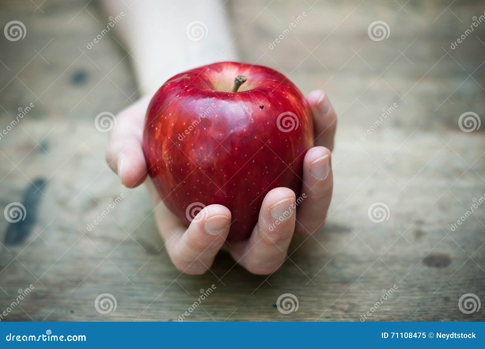 Red Apple and Hand on Wooden Table Background Stock Image - Image of ...