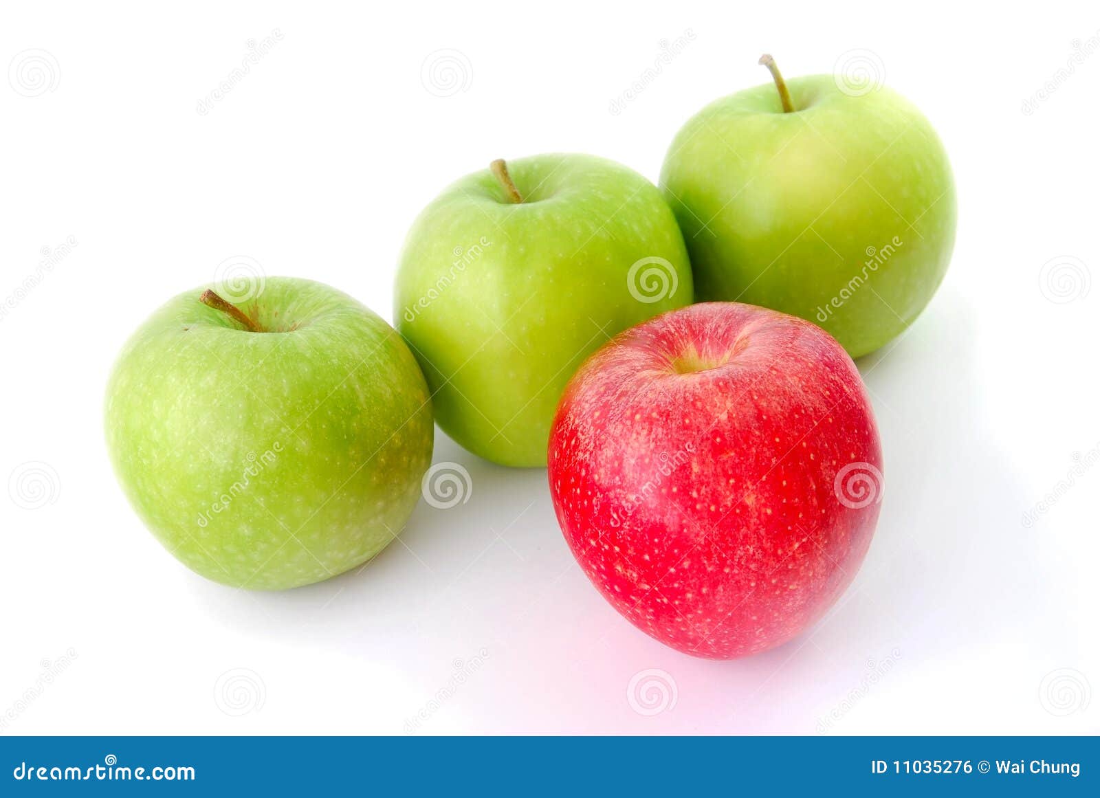 Red Apple Leading a Group of Three Apples Stock Photo - Image of ...
