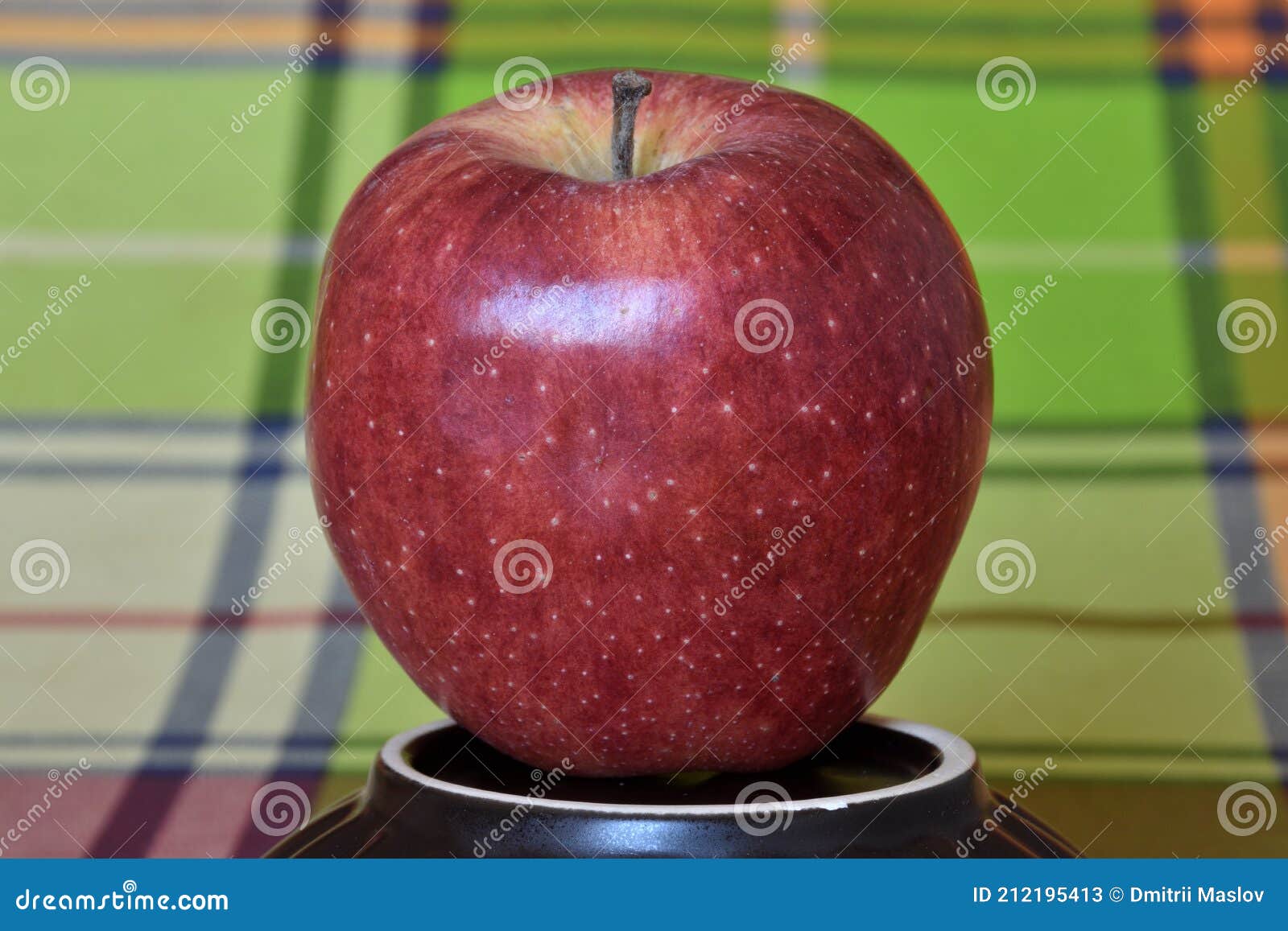 Side View of a Ripe Red Apple Lying on an Upside Down Plate. Stock ...