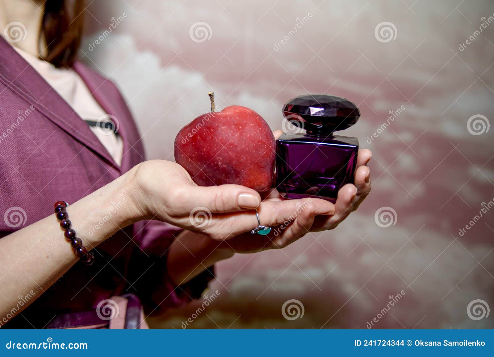 Red Apple and Perfume Bottle in Perfumer Hand Close-up Stock Photo ...