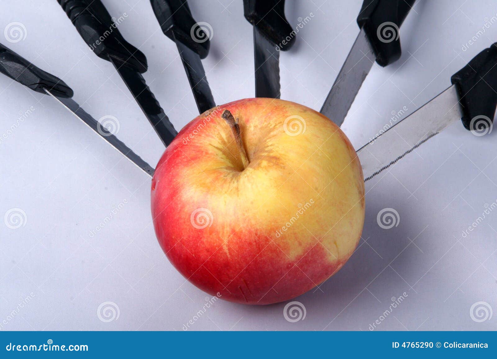 Red Apple Pierced with Knives Stock Photo - Image of pierced, knife ...