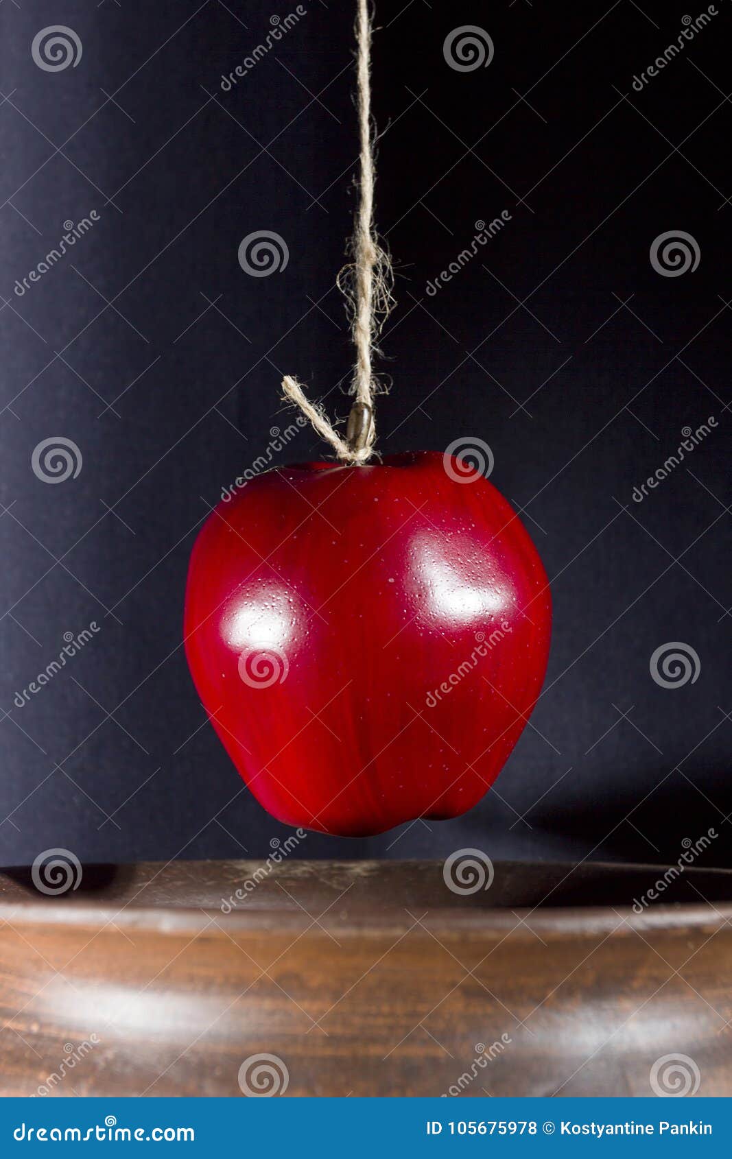 Apple on the Rope is Lowered into a Pot Stock Photo - Image of rope ...