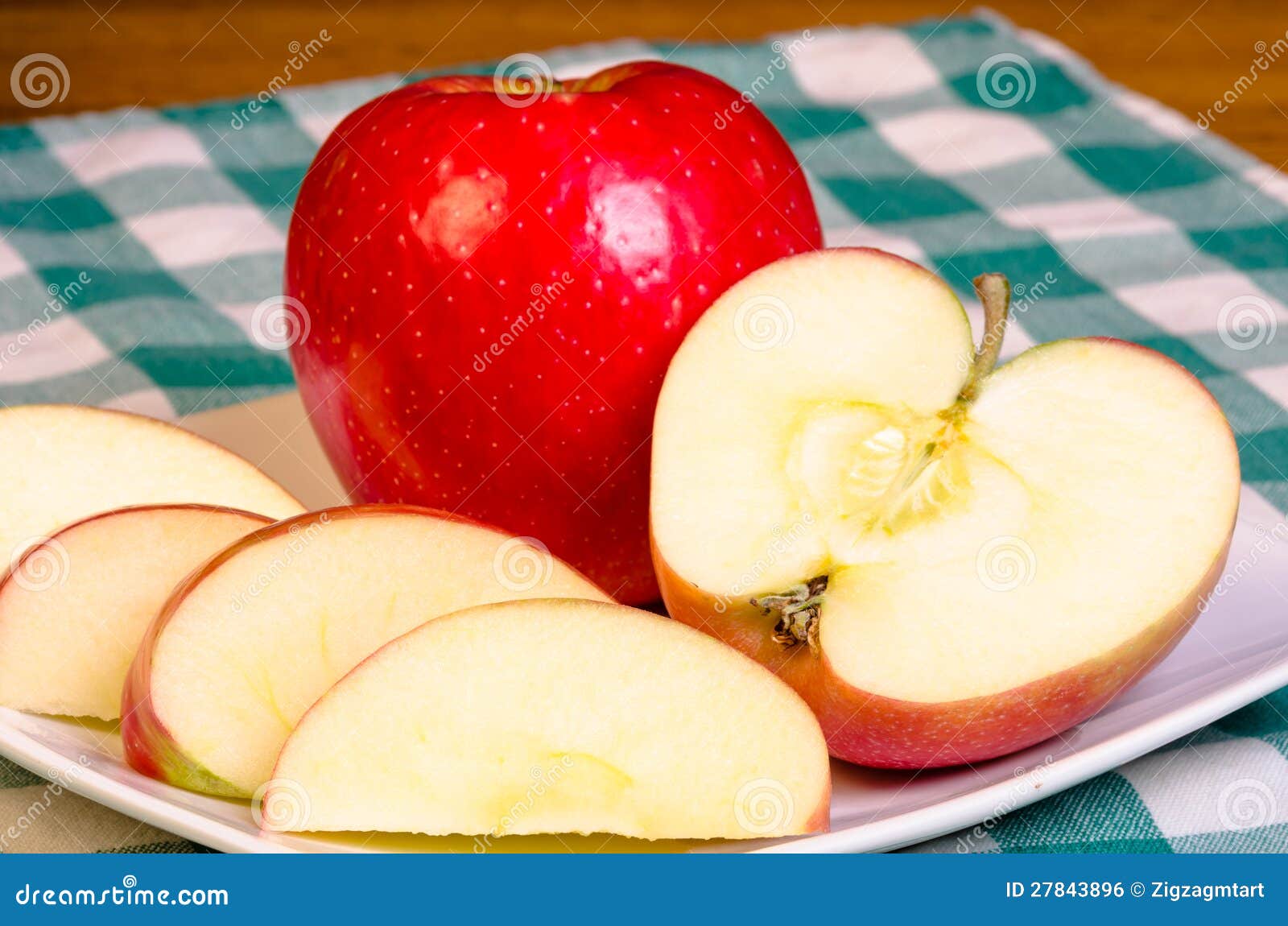Red apple sliced on plate stock photo. Image of delicious - 27843896