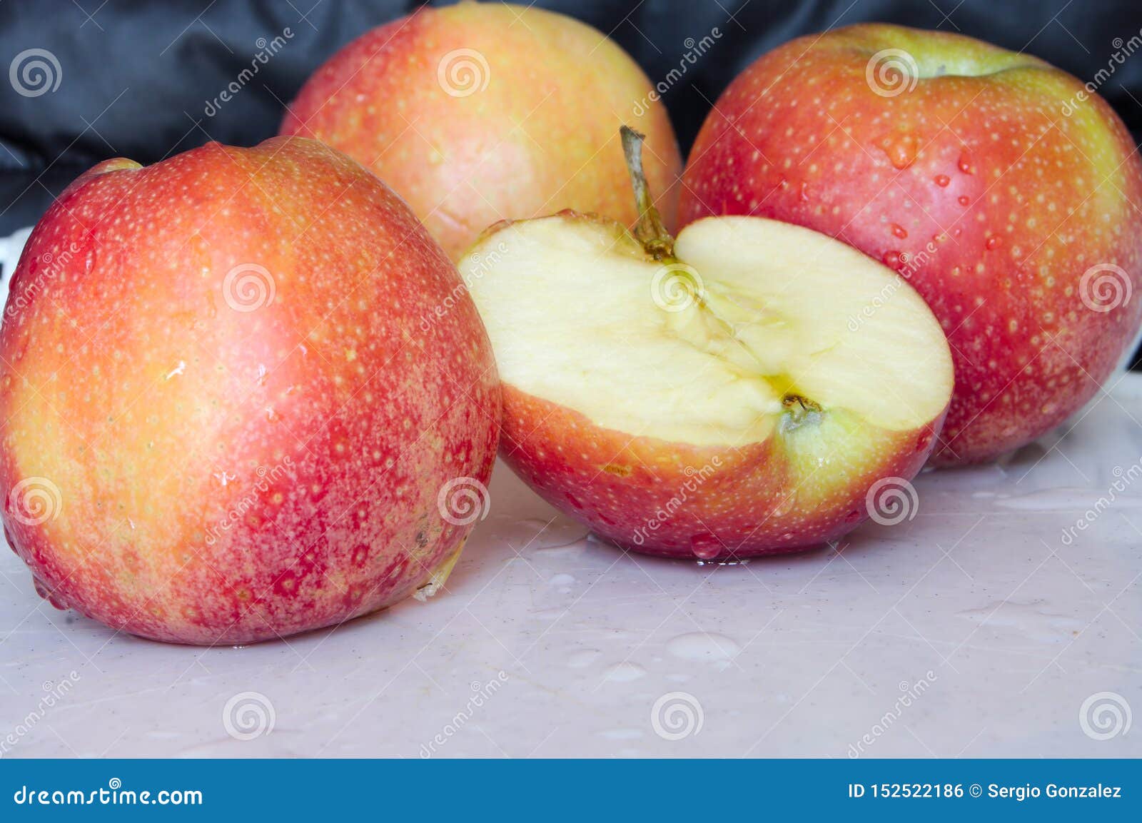 Red apple split in half stock photo. Image of leaf, apple - 152522186