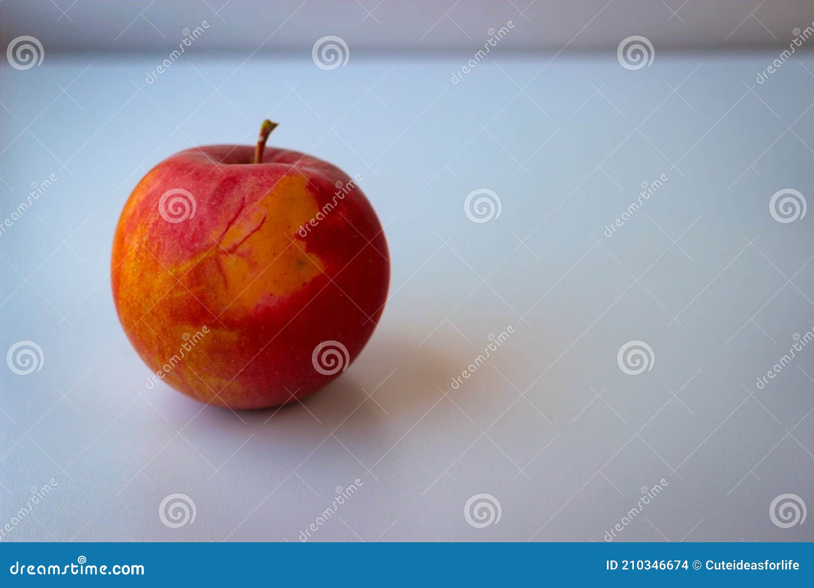 Red Apple Stand on a White Surface Stock Photo - Image of blur, bright ...