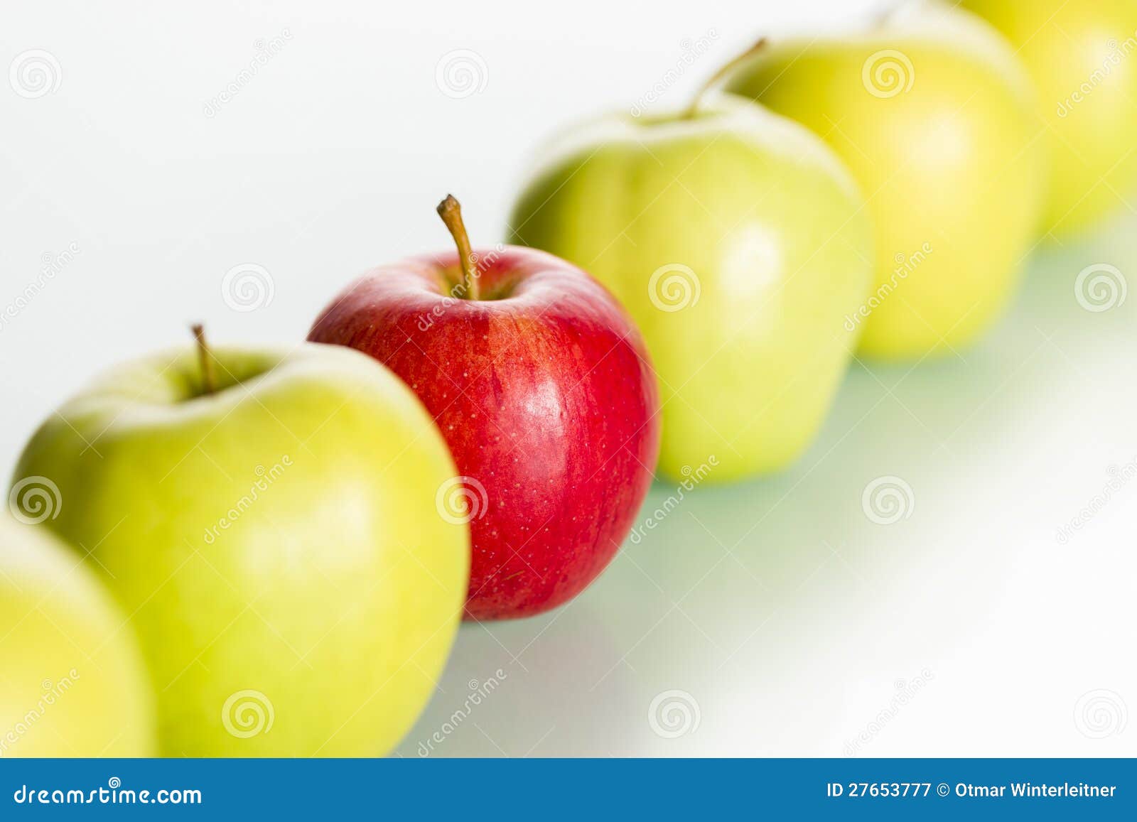 Red Apple Standing Out from Row of Green Apples. Stock Image - Image of ...