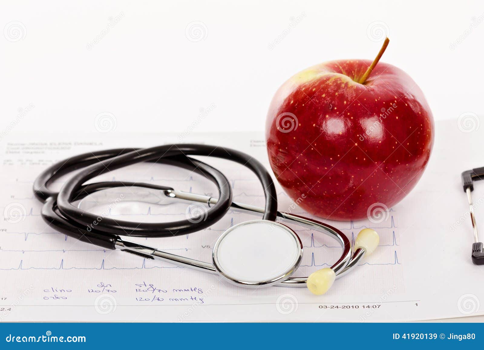 Red Apple And Stethoscope On An Electrocardiogram (ECG) Chart Royalty ...