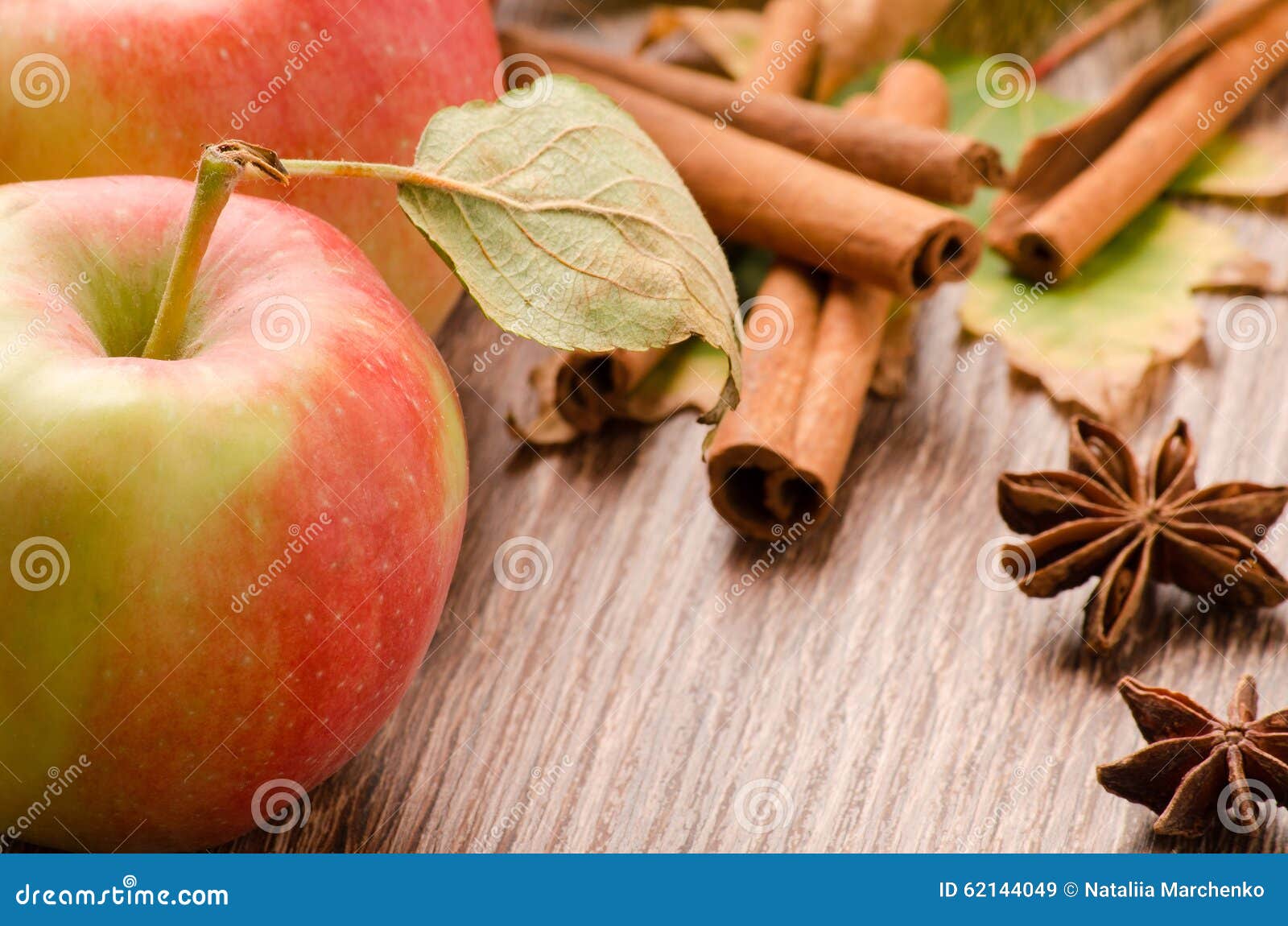 Red Apple, Sticks of Cinnamon and Anise on a Table Stock Image - Image ...
