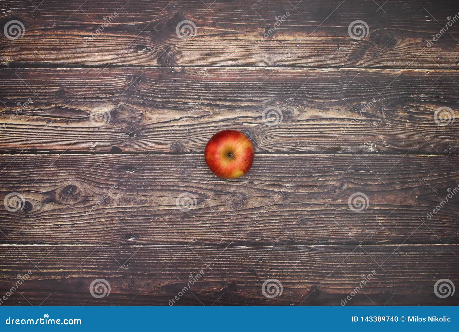 Red apple on the table stock photo. Image of grain, nature - 143389740