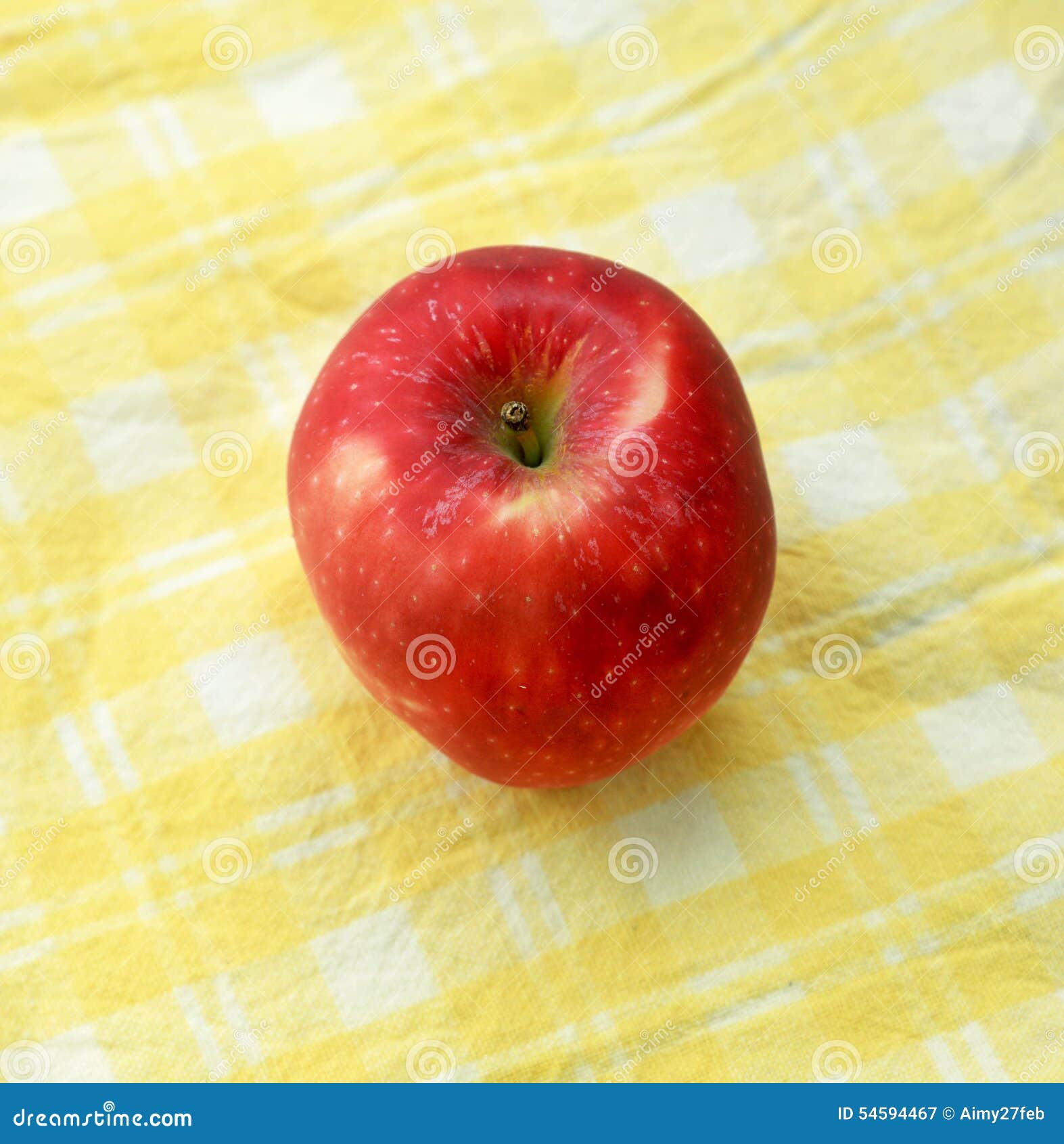 Red apple on a tablecloth stock image. Image of food - 54594467