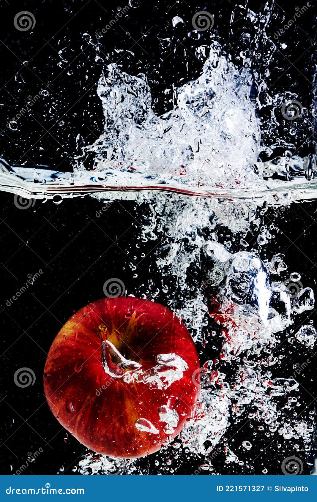 Red Apple Thrown into Water with Splash and Black Background Stock ...