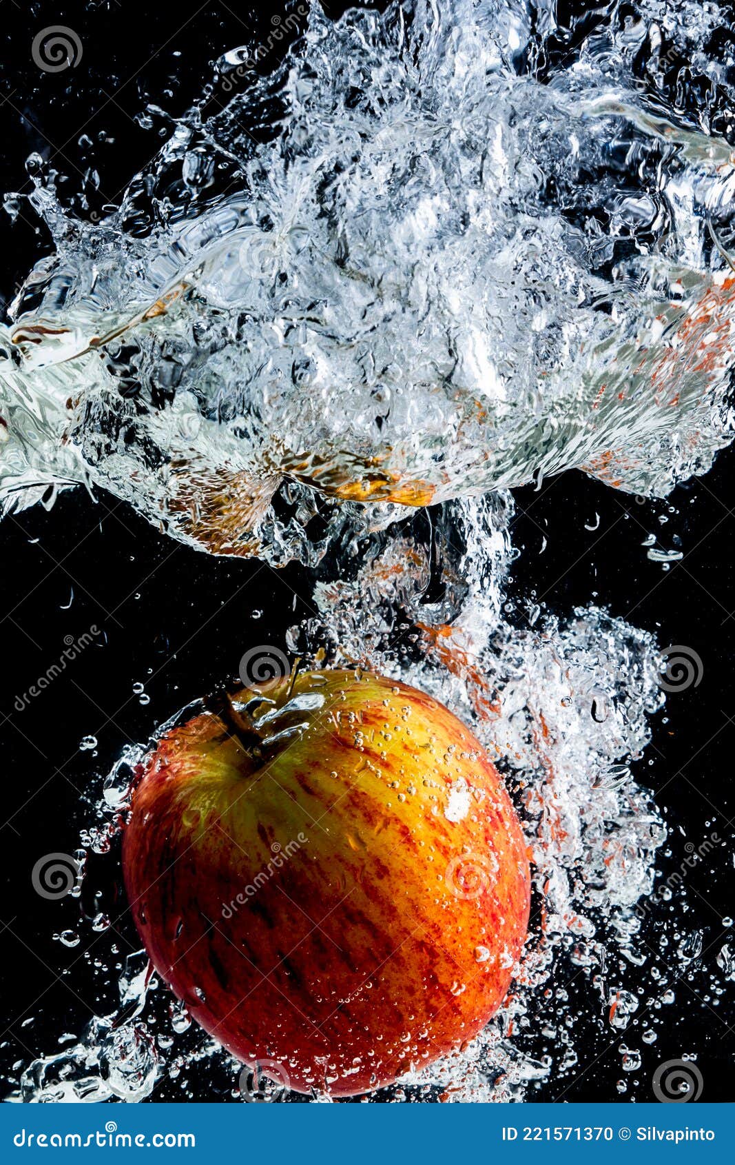Red Apple Thrown into Water with Splash and Black Background Stock ...