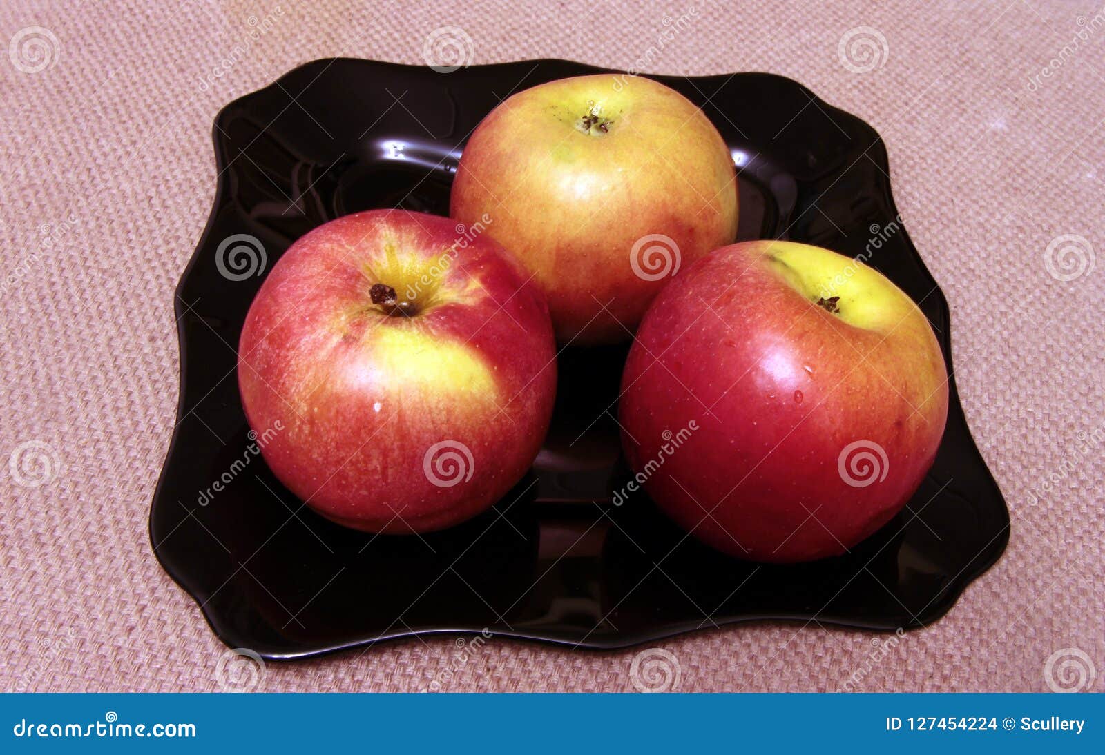 Red Apples on the Black Plate on the Table Stock Photo - Image of ...