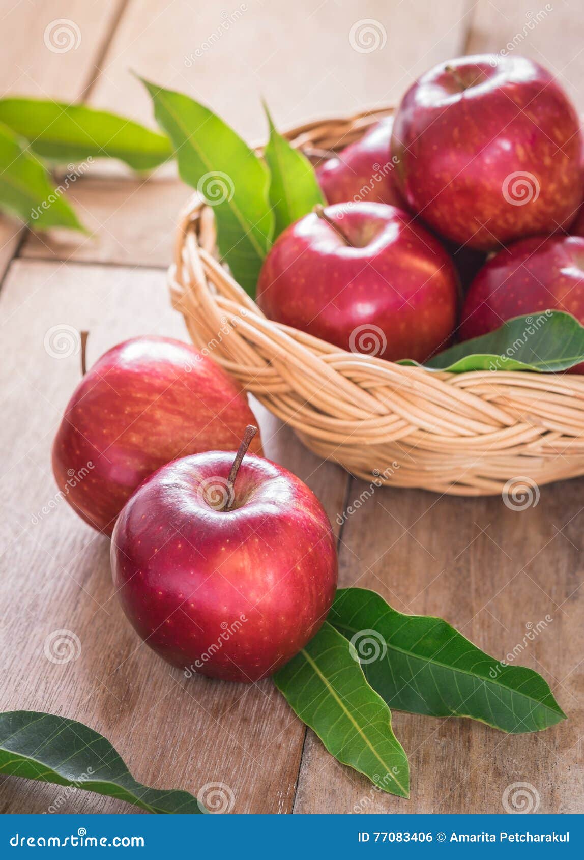 Red apples on wooden table stock photo. Image of food - 77083406