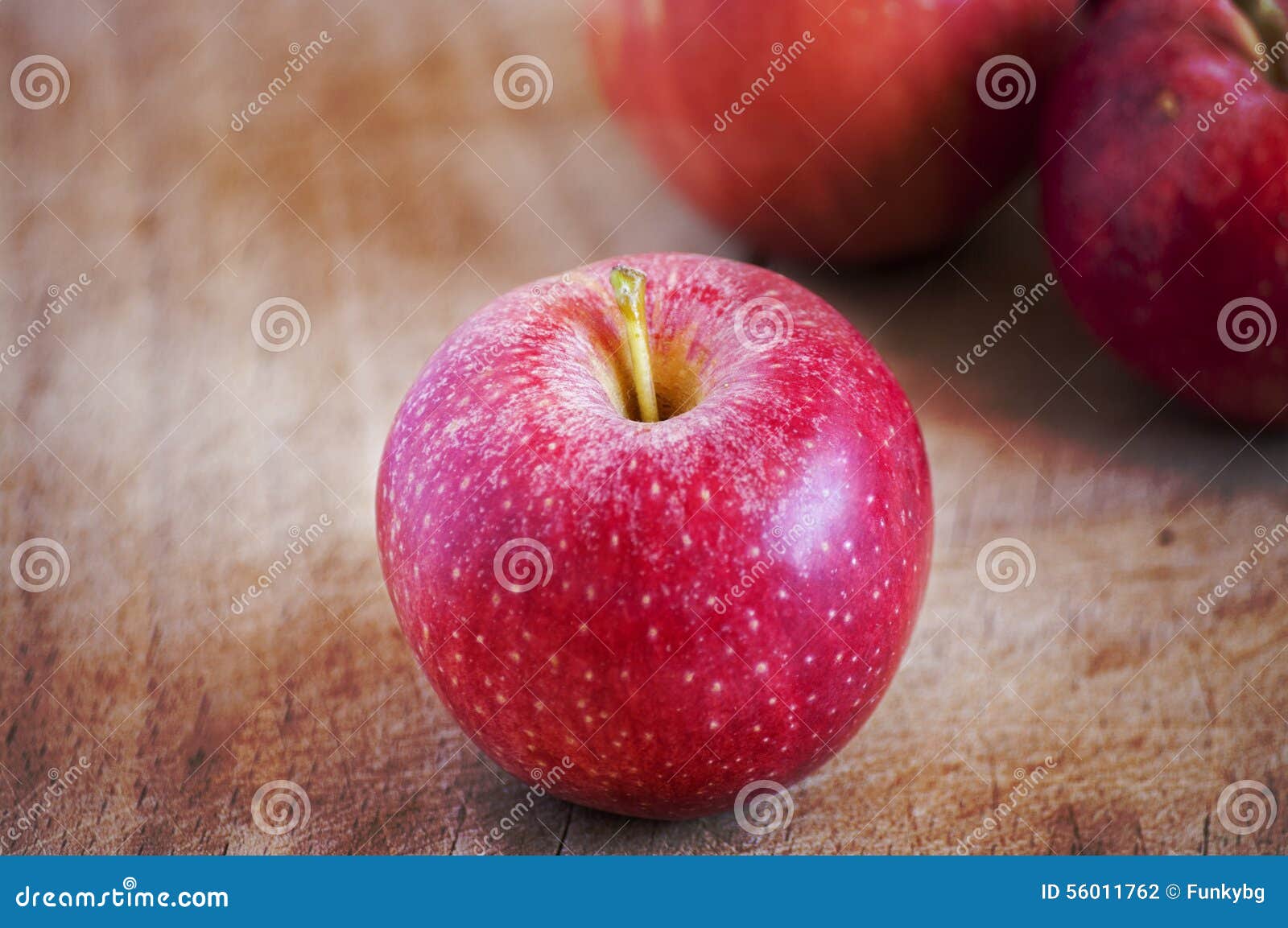 Red apples on wooden table stock photo. Image of health - 56011762
