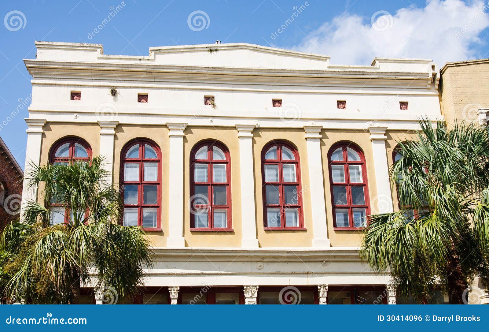 Red Arched Windows on Tropical Stucco Building Stock Photo - Image of ...