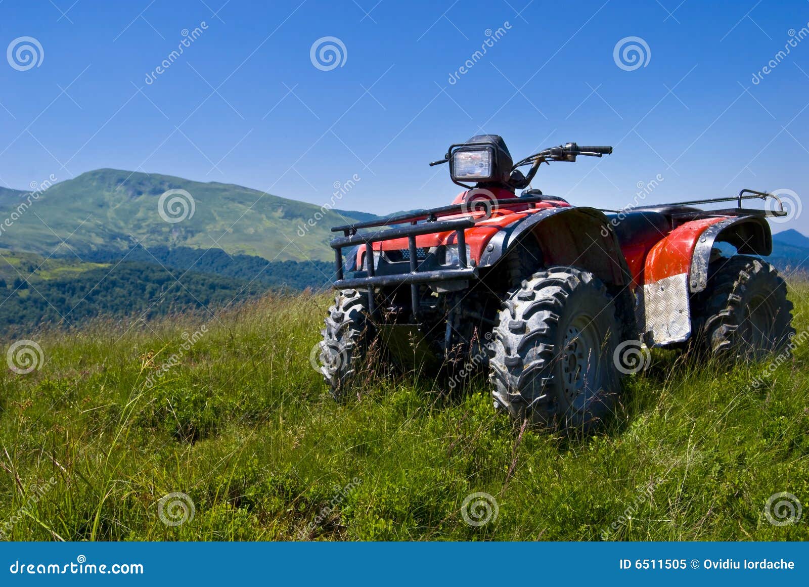 Red atv on highlands- quad stock image. Image of terrain - 6511505