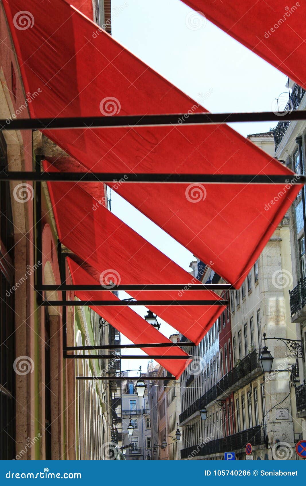 Red Awnings in the Streets of Lisbon Stock Photo - Image of clear ...