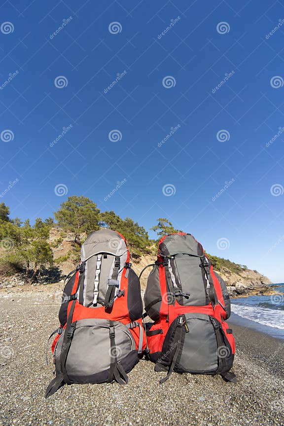 Red backpack on the beach. stock image. Image of expedition - 68144315