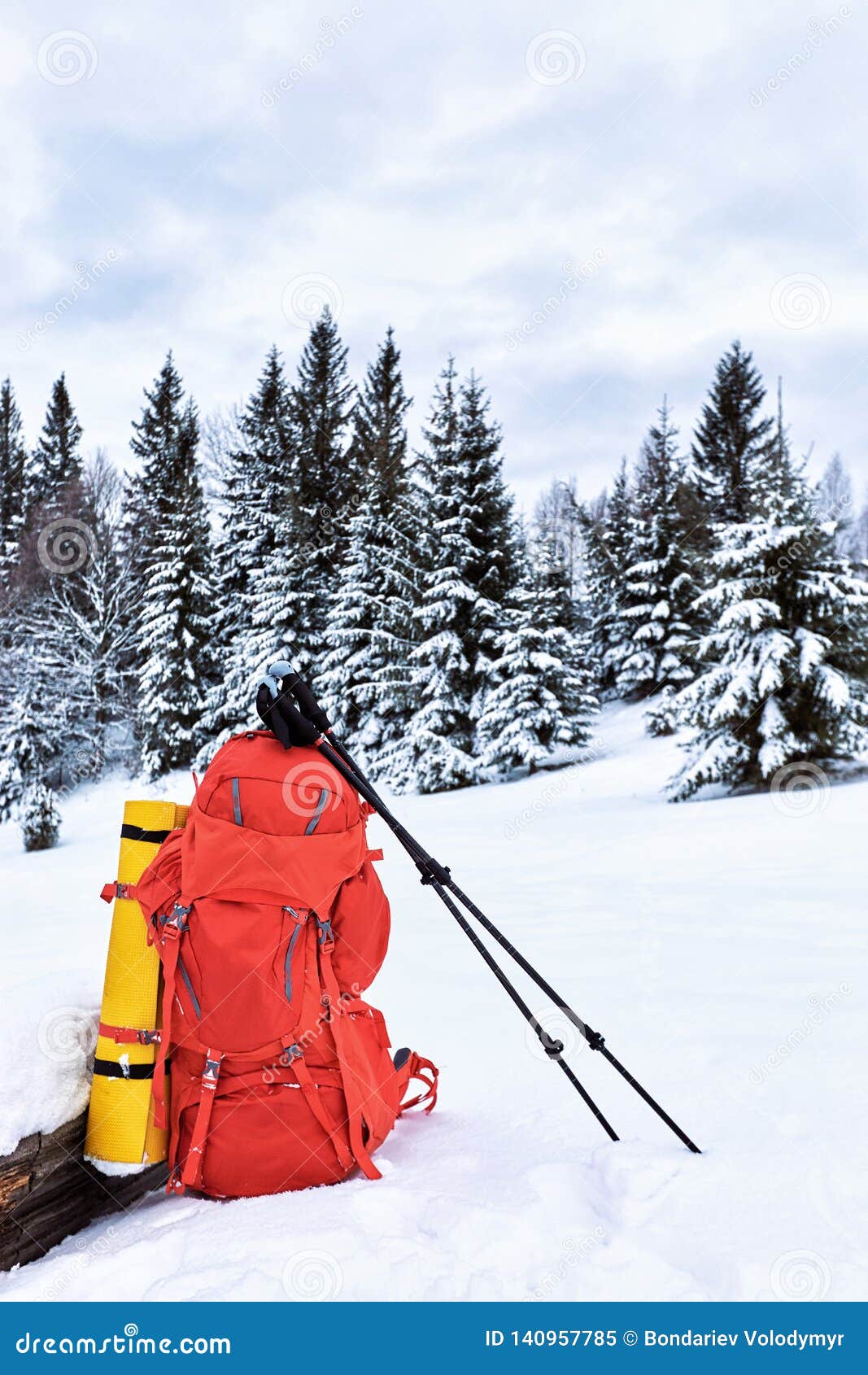 A Red Backpack on the Snow in a Winter Campaign Against the Backdrop of ...