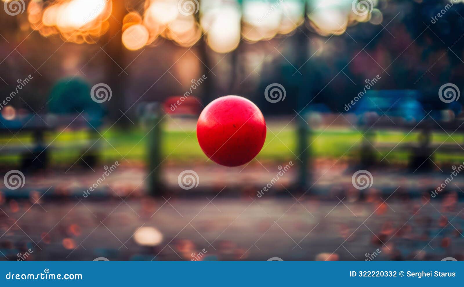 A Red Ball Flying through the Air in Front of a Park Bench, AI Stock ...
