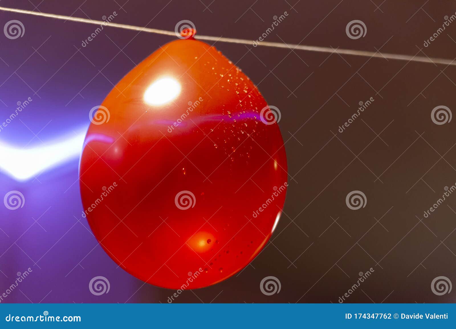 A Red Balloon Hanging on a Thread and Wet Stock Photo - Image of baloon ...