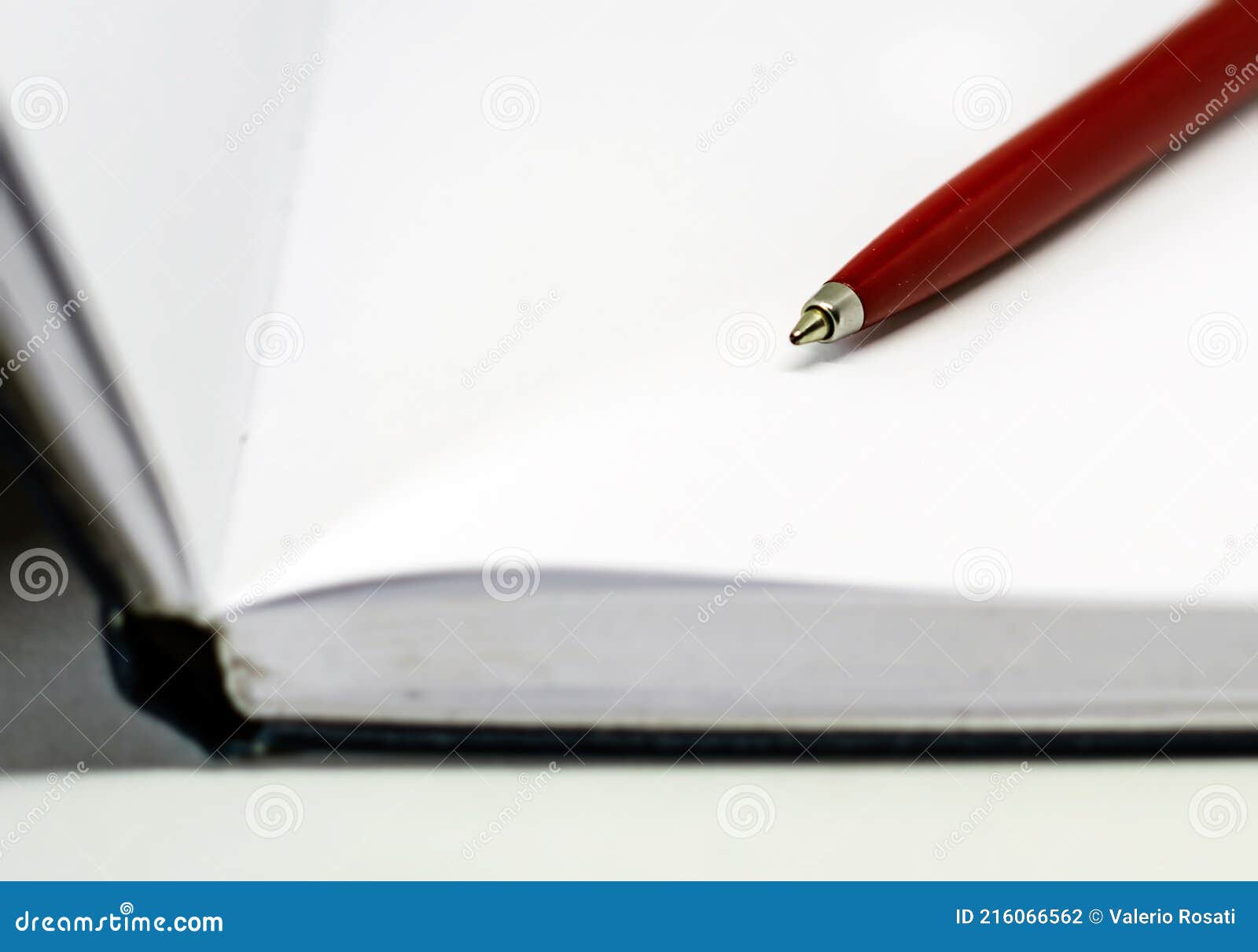 Red Ballpoint Pen on the Blank White Pages of an Open Notebook Stock ...