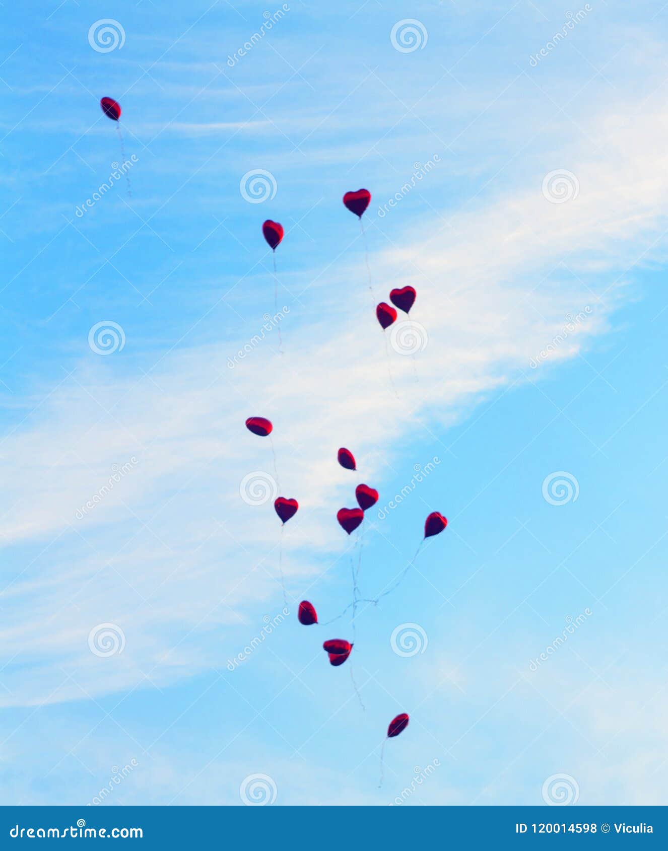 Red Balls in the Form of a Heart Fly into the Blue Sky. Stock Photo ...