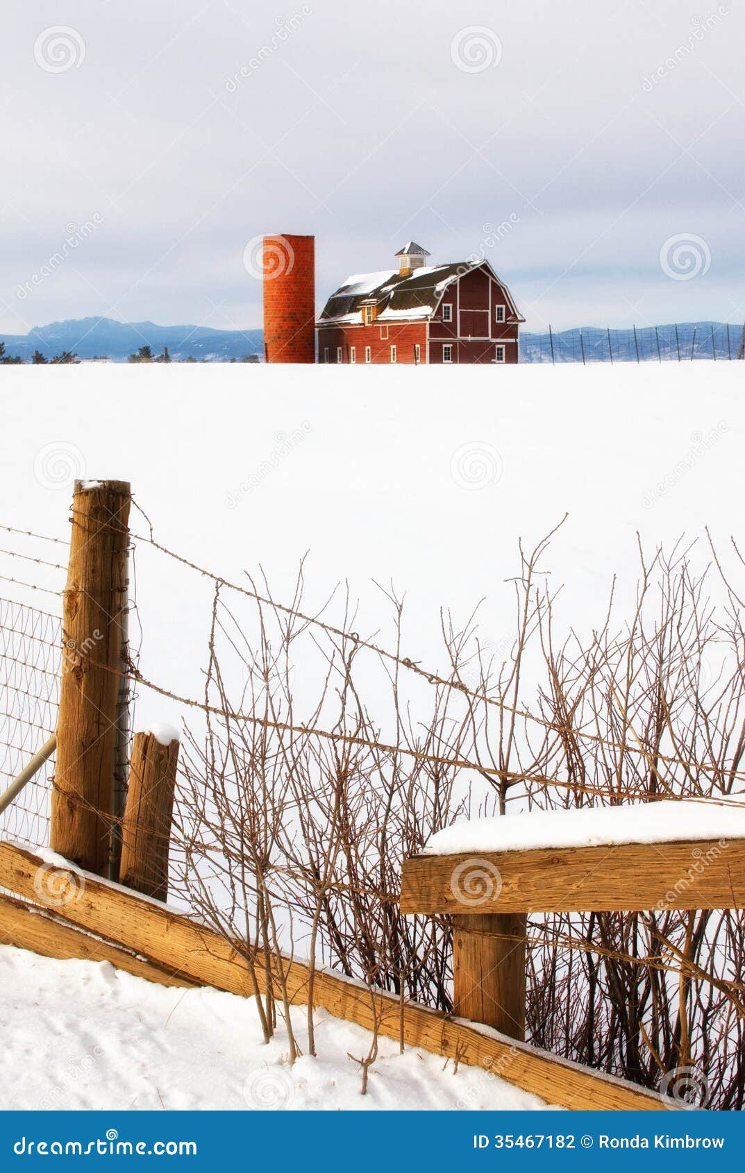 Red Barn in the Snow with a Rustic Fence Stock Photo - Image of barn ...