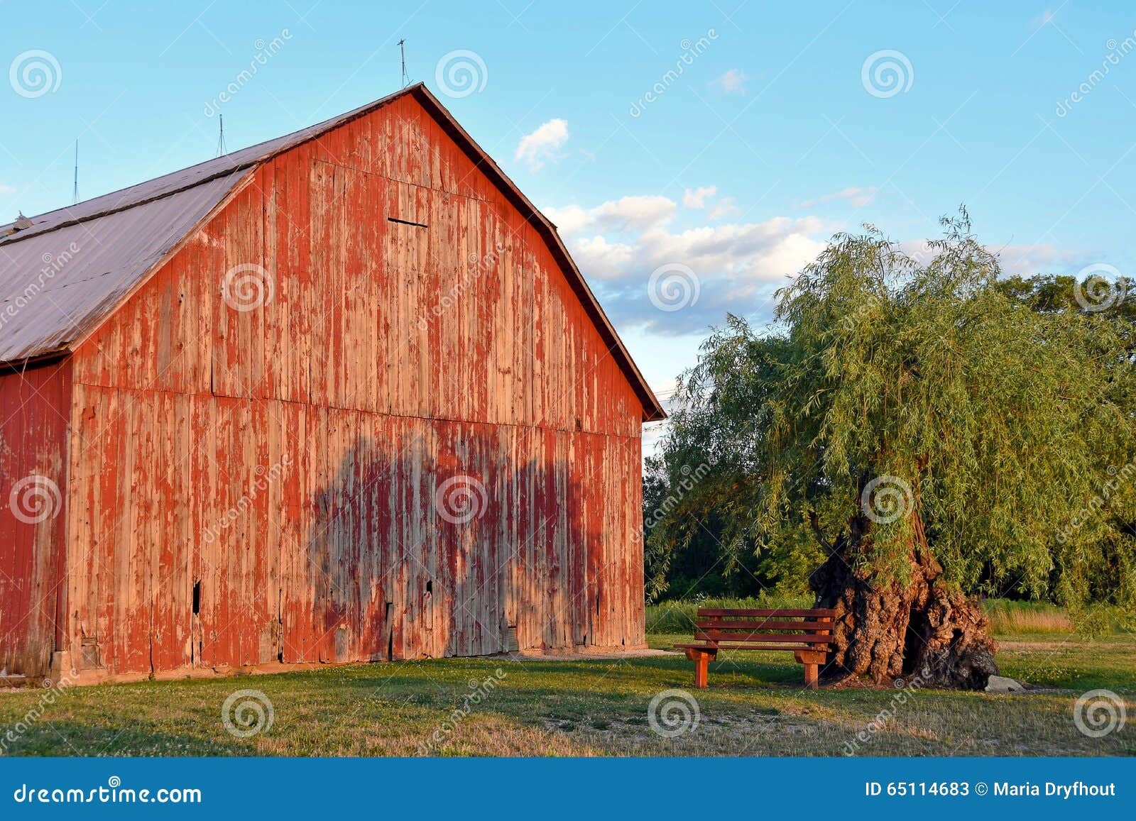Red barn with tree shadow stock image. Image of barn - 65114683
