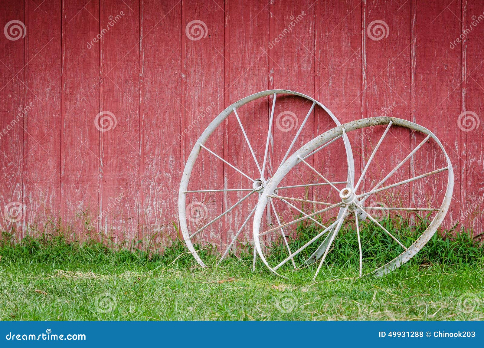 Red Barn with wagon wheels stock photo. Image of country - 49931288