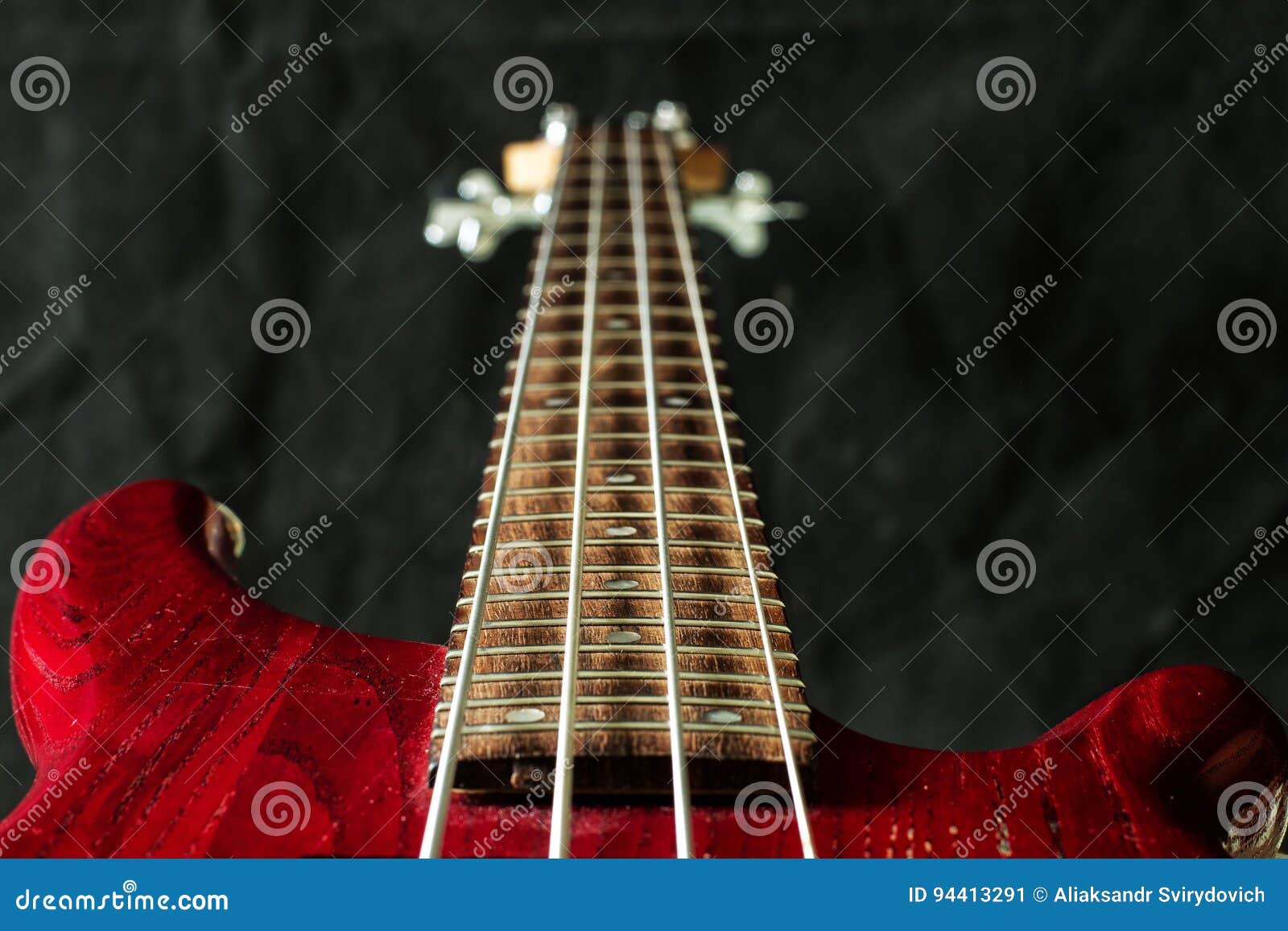 Red Bass Guitar with Four Strings on Dark Background Stock Image ...