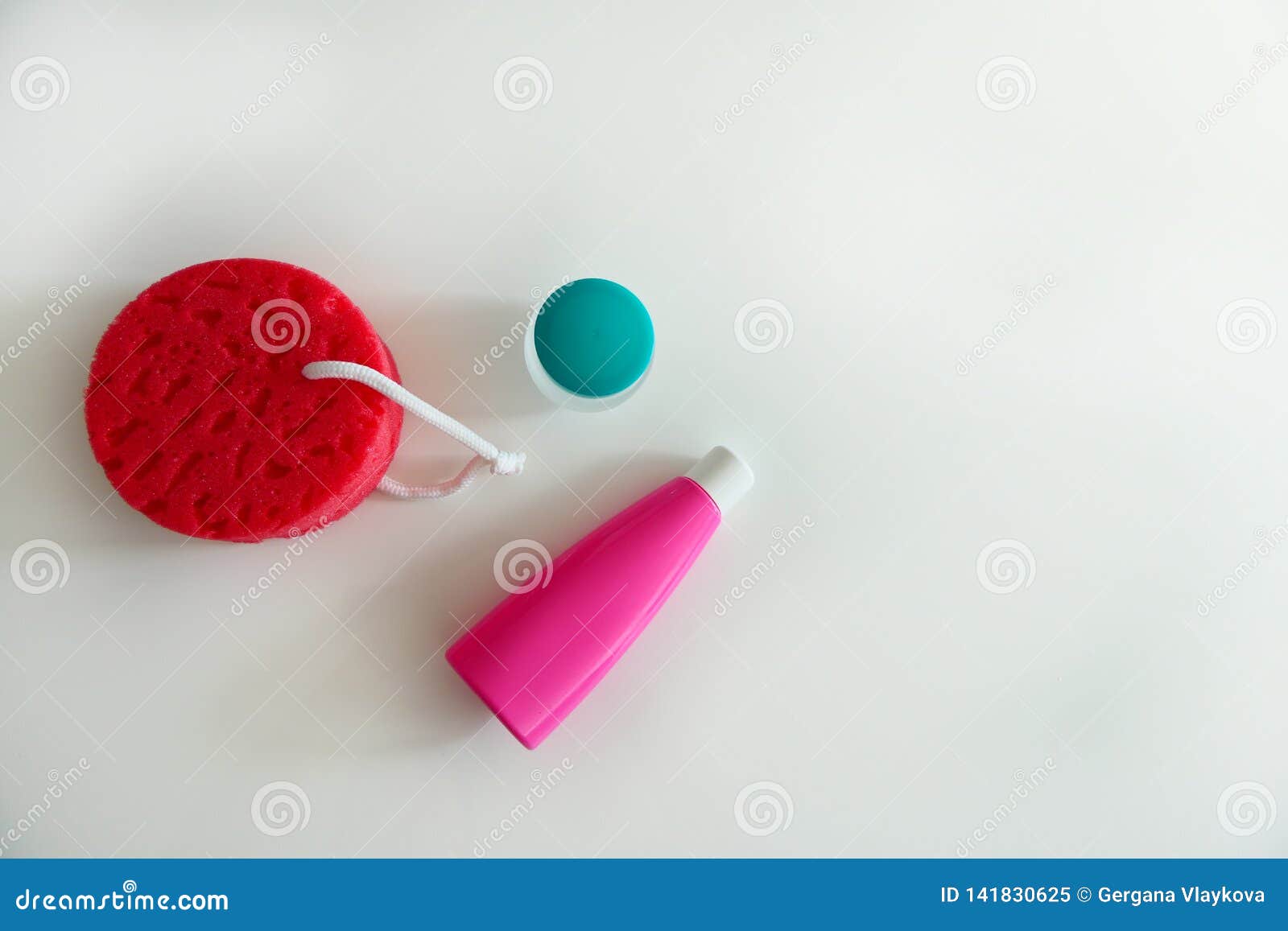 Red Bath Sponge and Cosmetics Bottles Isolated on White Background ...