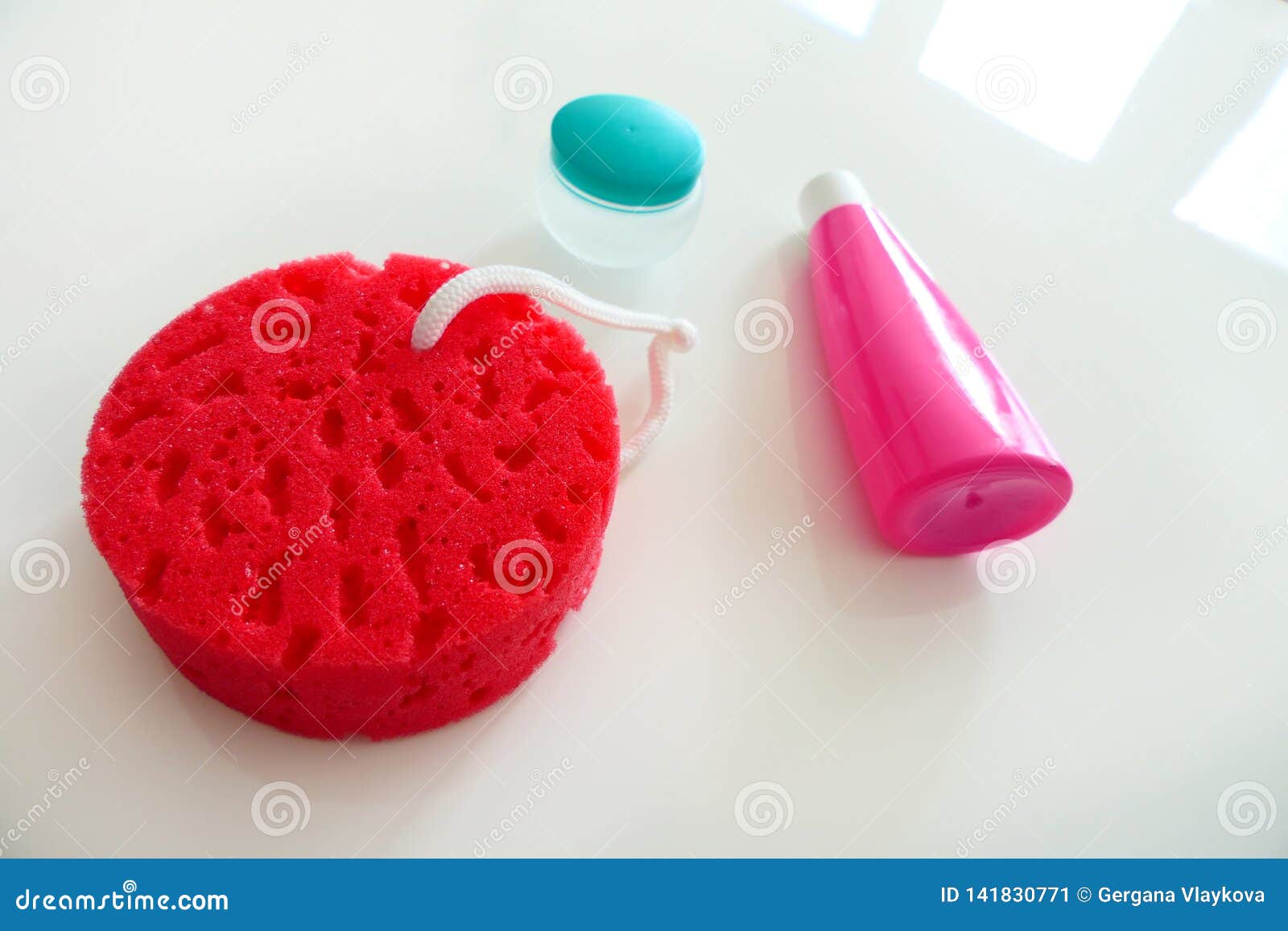 Red Bath Sponge and Cosmetics Bottles Isolated on White Background ...
