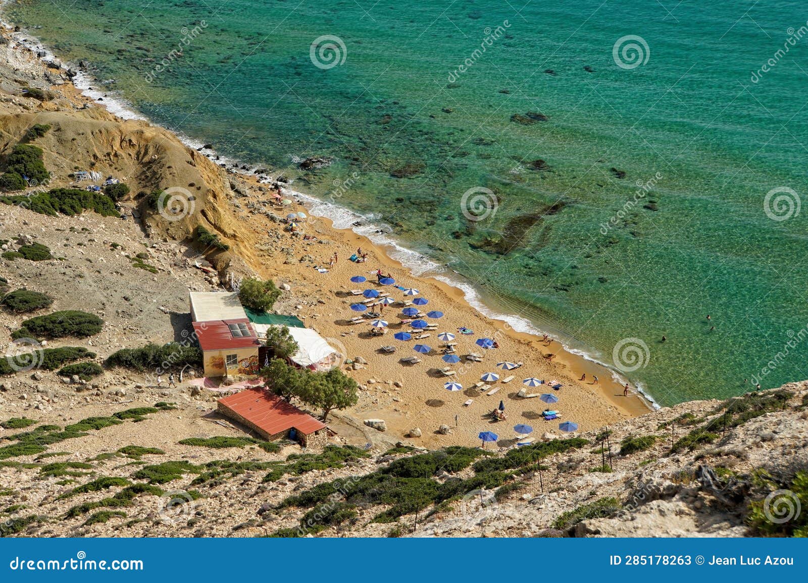 Red Beach in Matala, Crete stock image. Image of umbrella - 285178263
