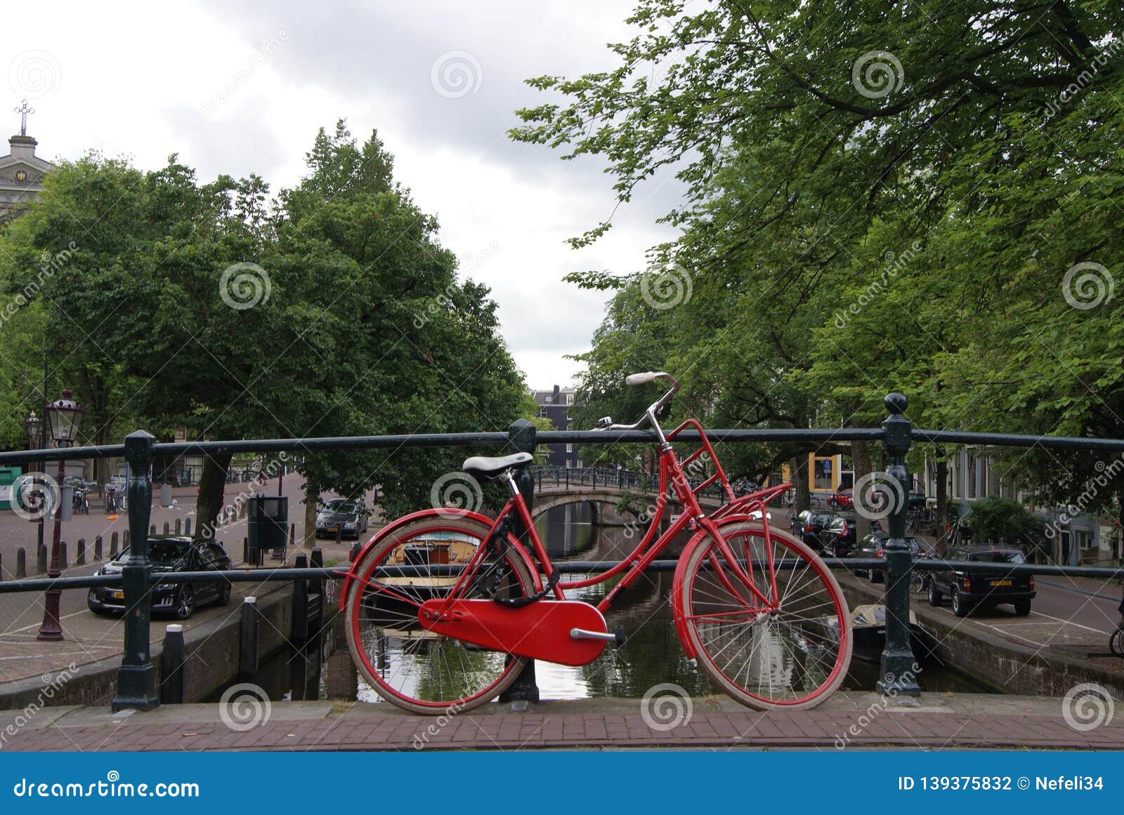 Red Bicycle on Amsterdam Bridge Over Canal Editorial Photography ...