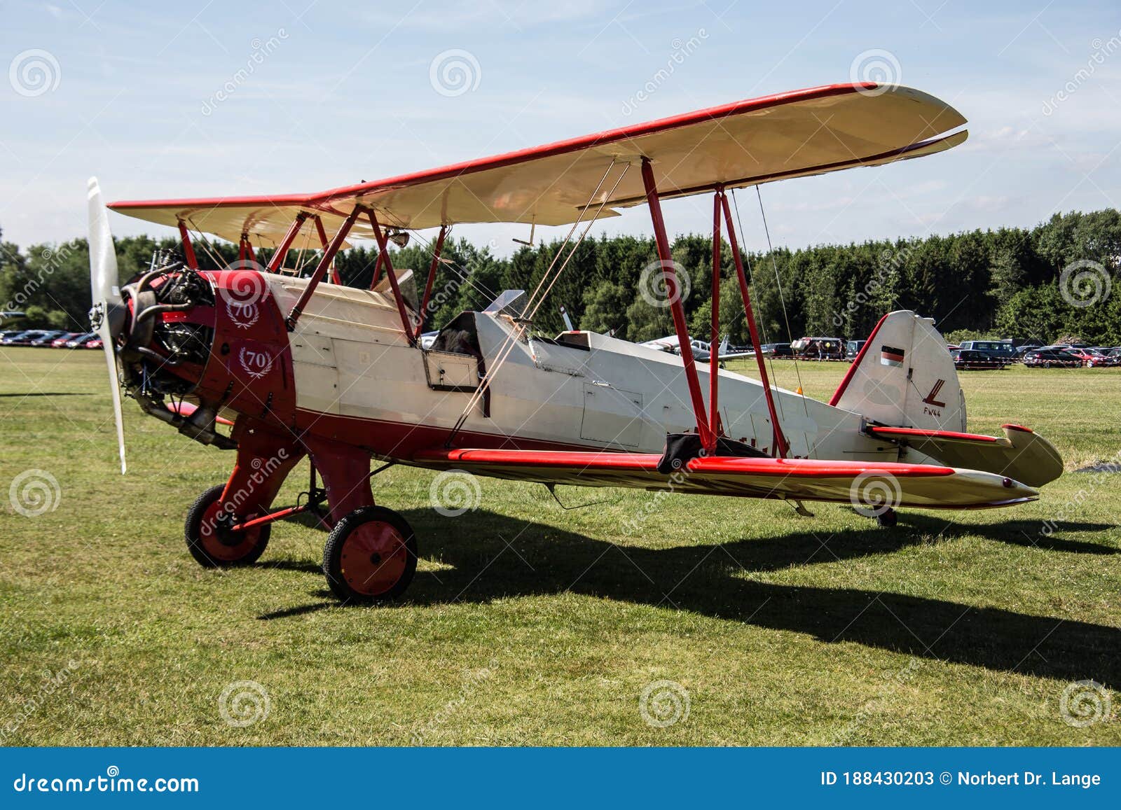 Red Biplane Airplane on Meadow Editorial Stock Photo - Image of field ...